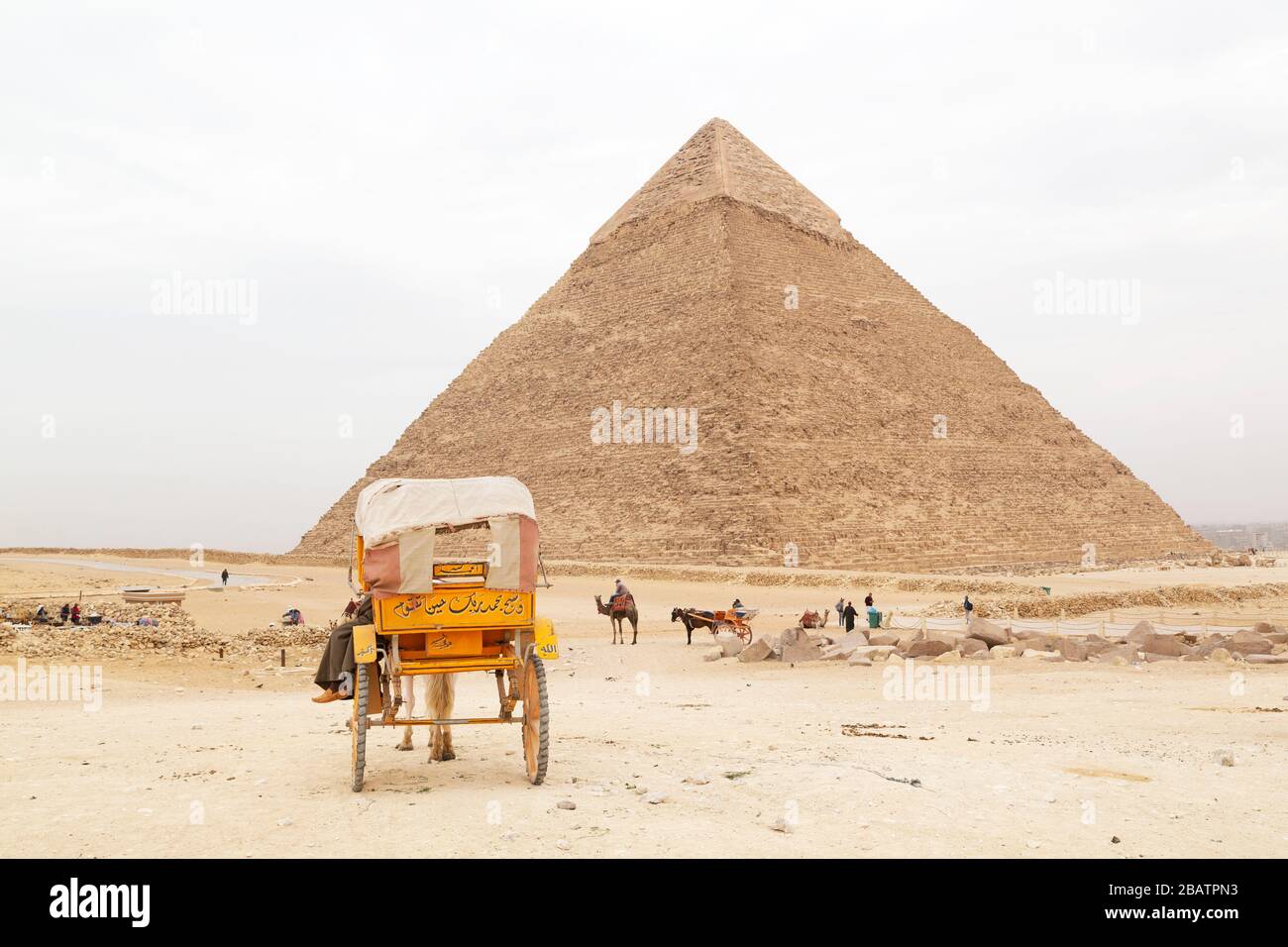 A horse-drawn cart parked by the Pyramid of Khufu, also known as the ...