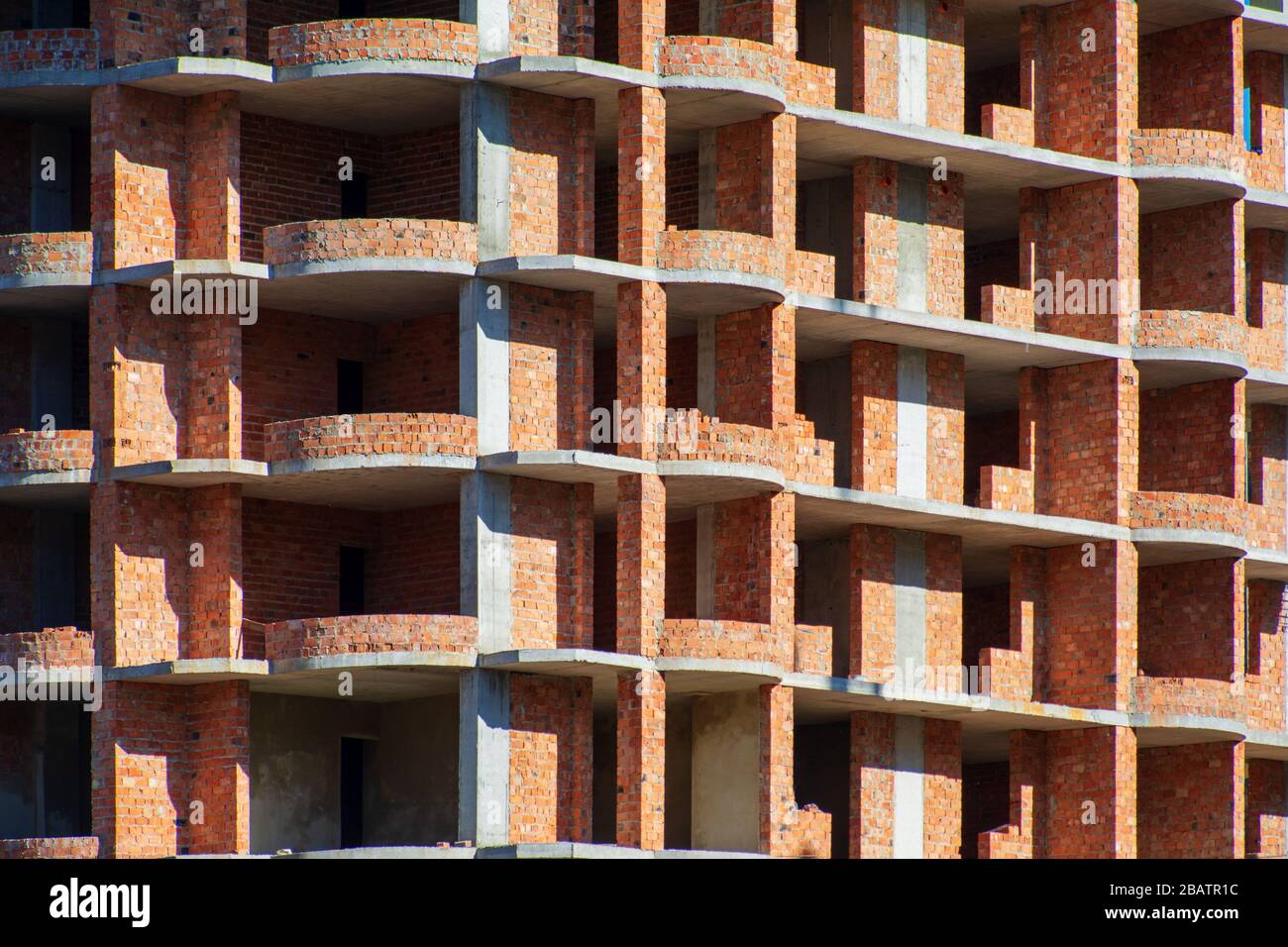 Unfinished brick multi-storey residential building, texture, background ...
