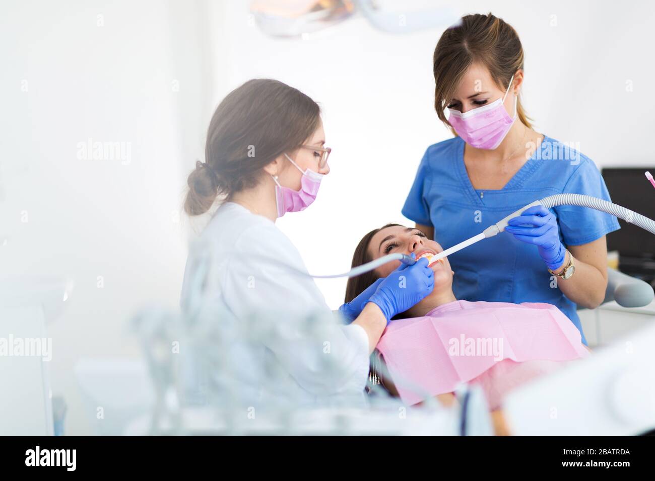 Nurse cleaning teeth hi-res stock photography and images - Alamy