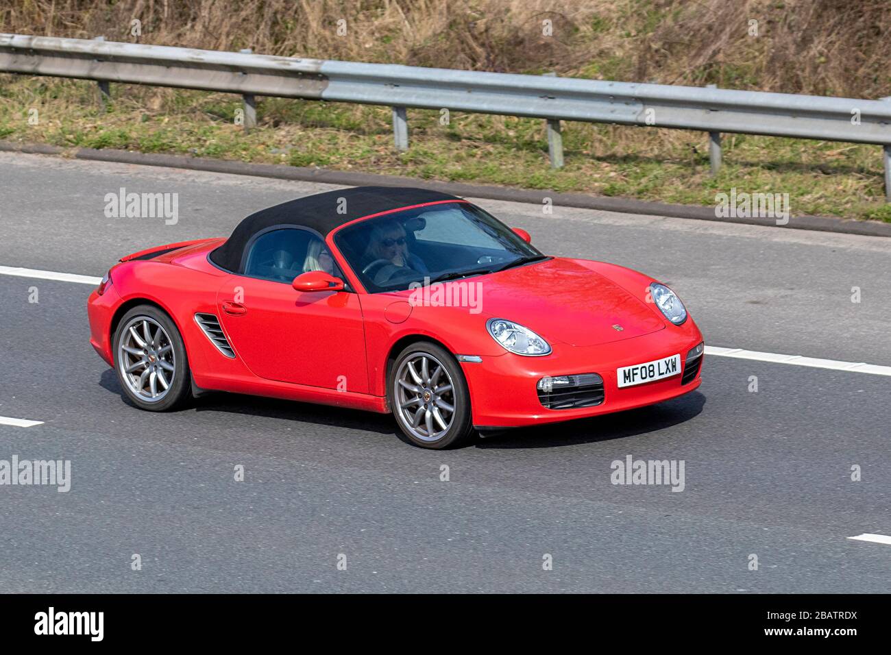 2008 Red Porsche Boxster convertible two-seater sports car; Vehicular ...