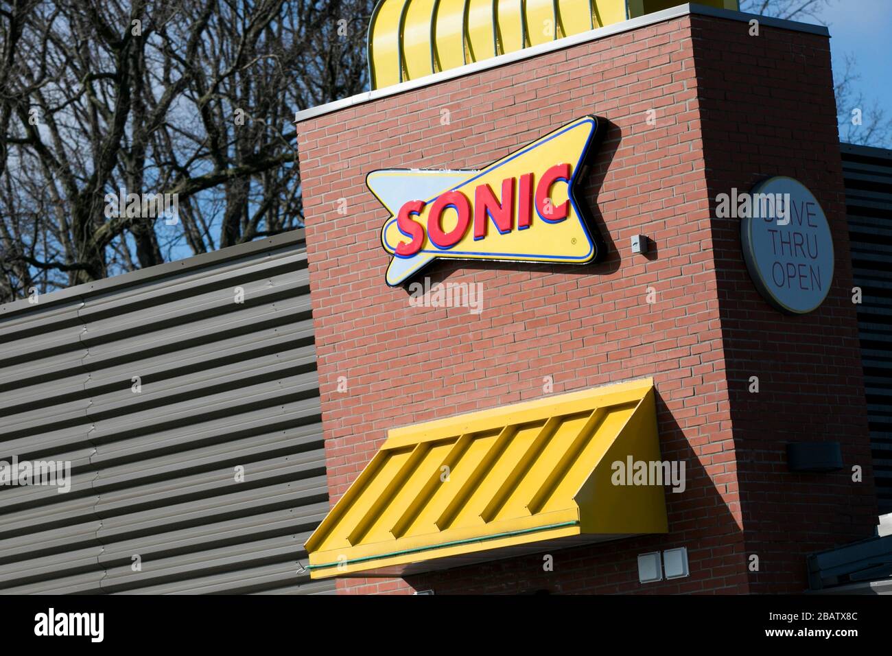 A logo sign outside of a Sonic restaurant location in Towson, Maryland ...