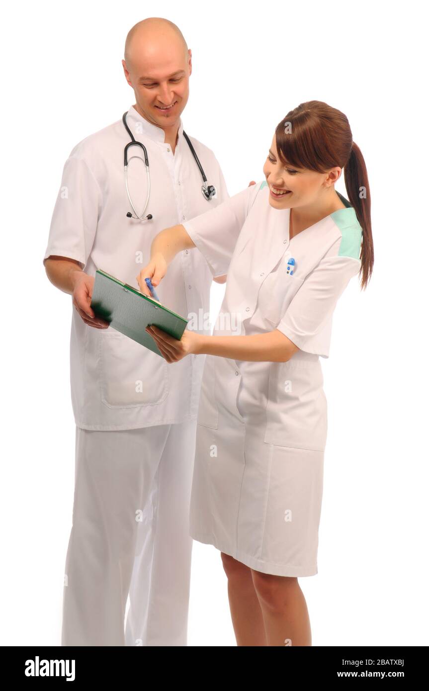 Two medical assistants smiling over the notes Stock Photo - Alamy