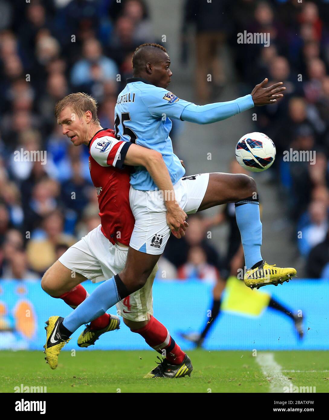 Arsenal's Per Mertesacker (left) and Manchester City's Mario Balotelli ...