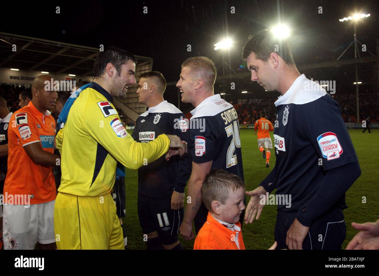 Blackpool goalkeeper matt gilks shakes hands with former team mate hi ...