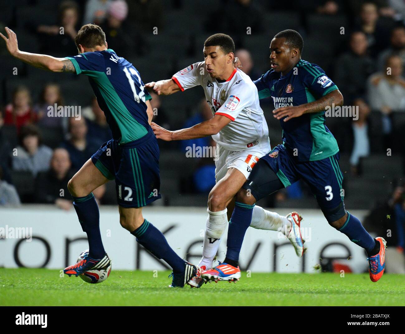 Milton Keynes Dons' Daniel Powell and Sunderland's Matt Kilgallon (left ...