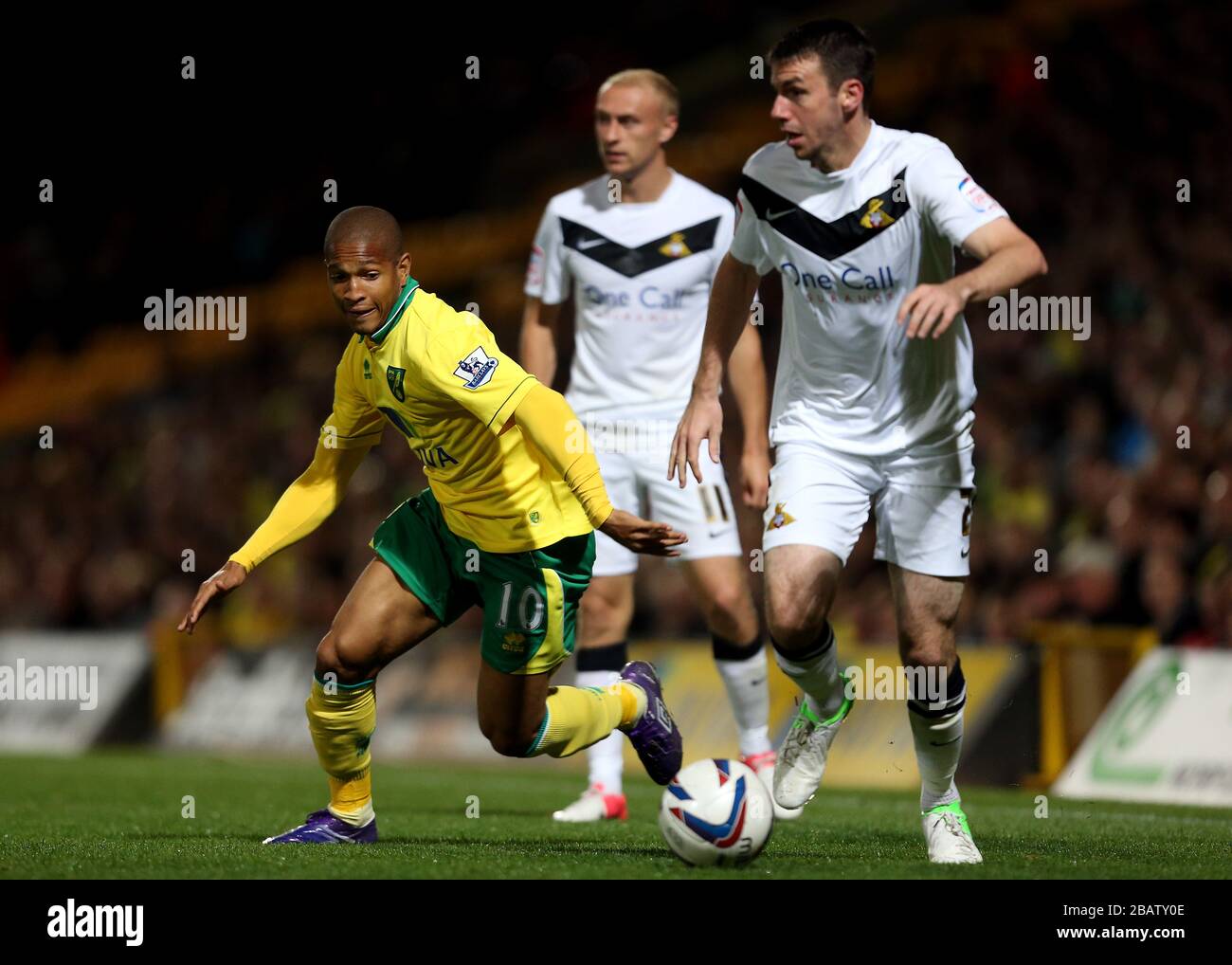 Norwich City's Simeon Jackson and Doncaster Rovers' Paul Quinn battle ...