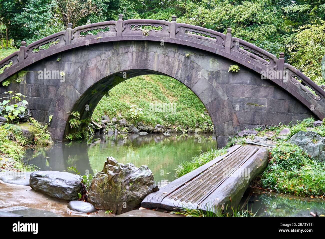 Oval shape old bridge over the pond Stock Photo - Alamy