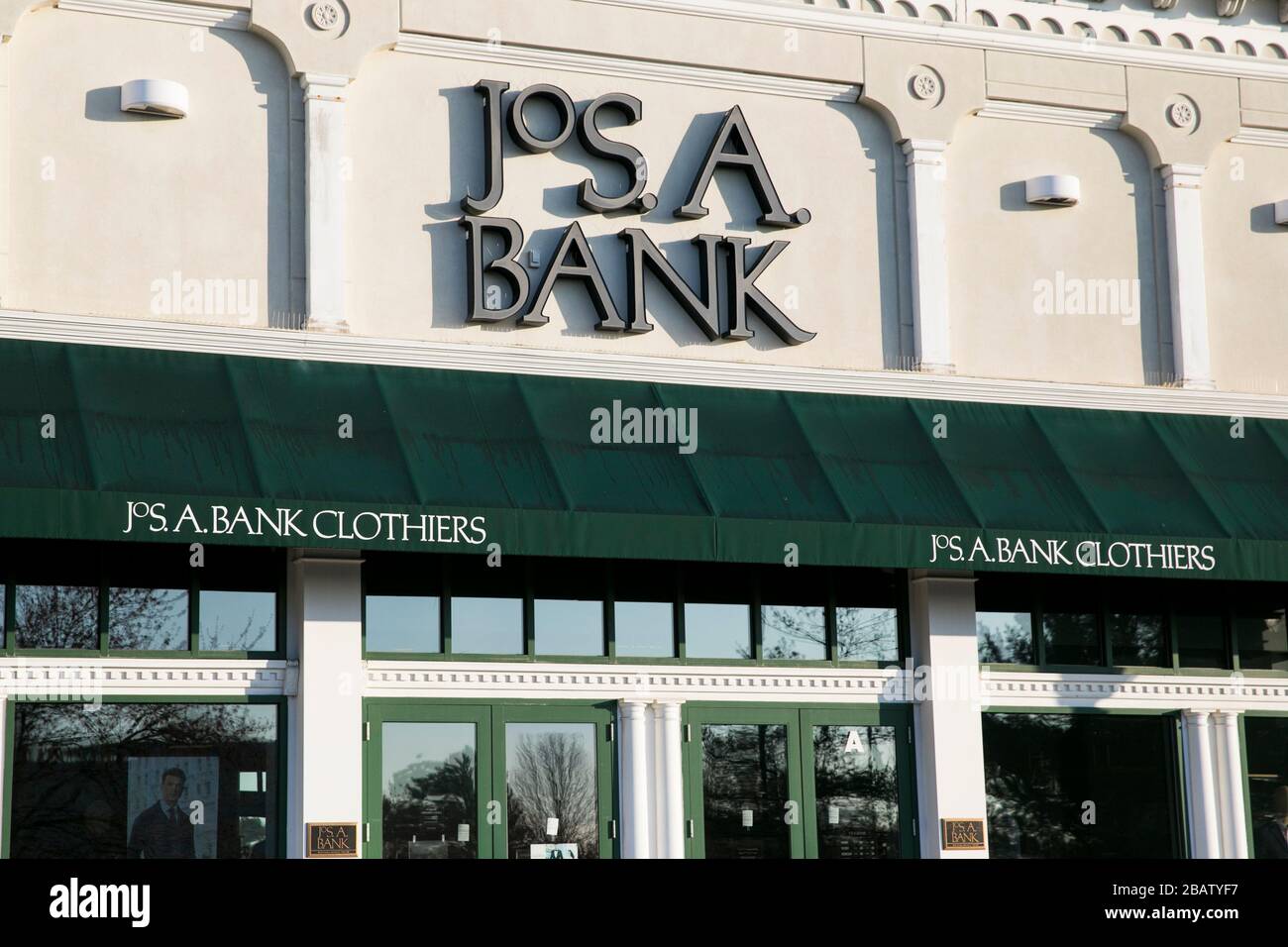 A logo sign outside of a JoS. A. Bank retail store location in Bel Air ...
