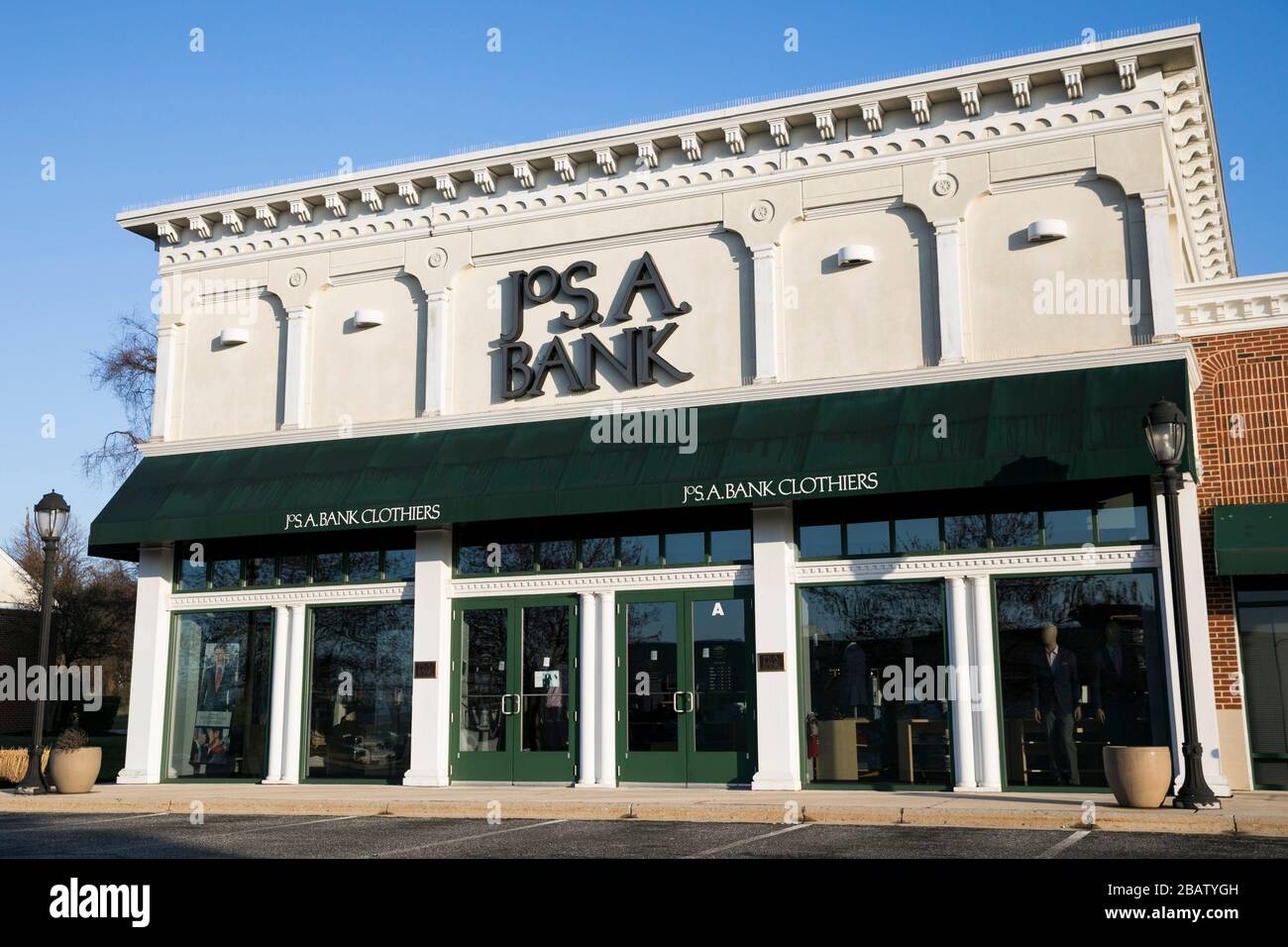 A logo sign outside of a JoS. A. Bank retail store location in Bel Air ...