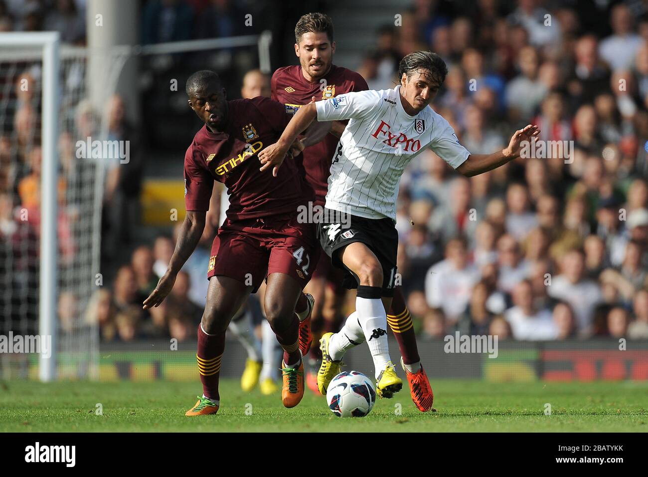 Fulham's Bryan Ruiz and Manchester City's Yaya Tour battle for the ball ...