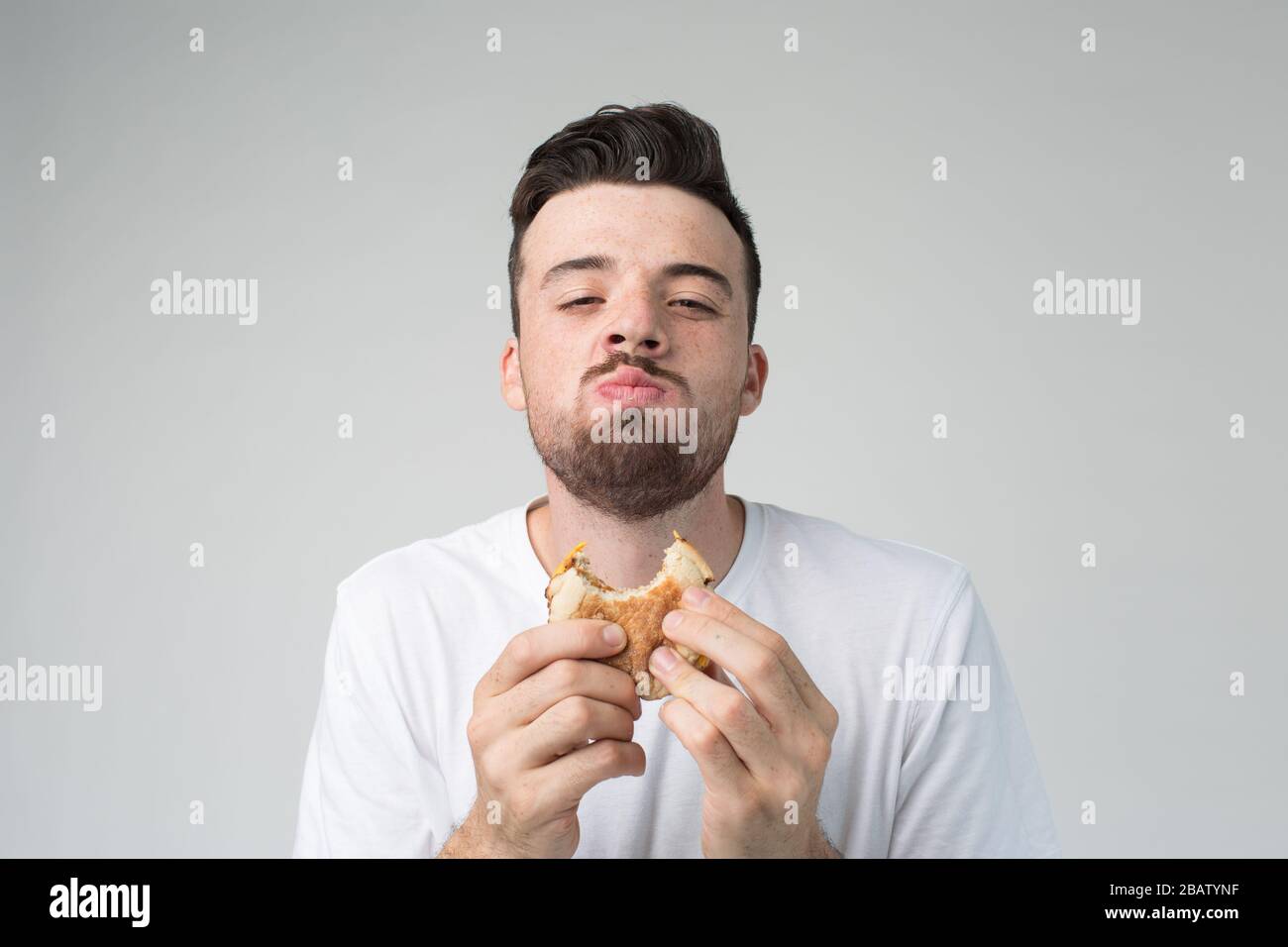 Fat man eating burger restaurant hi-res stock photography and images ...