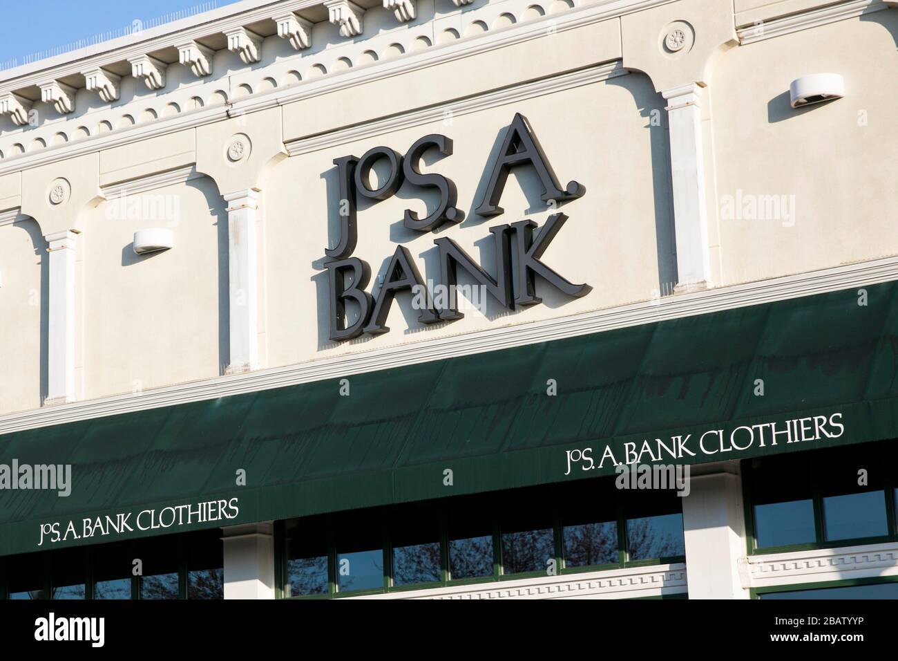 A logo sign outside of a JoS. A. Bank retail store location in Bel Air ...