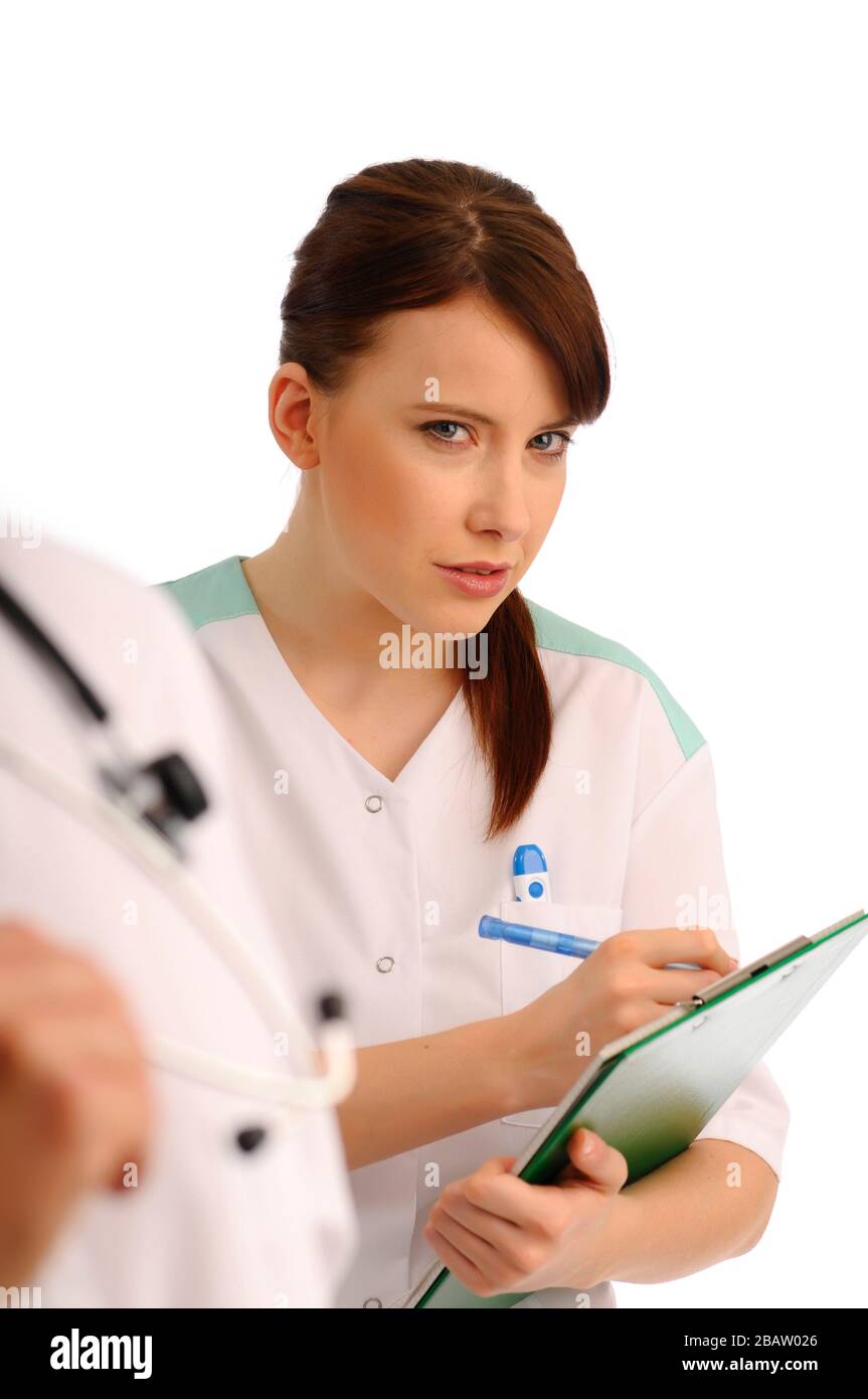 Medical nurse writing notes Stock Photo - Alamy