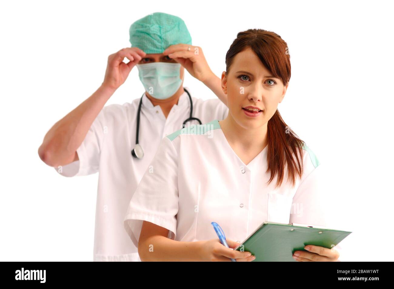 Medical nurse with notes, doctor wearing cap Stock Photo - Alamy