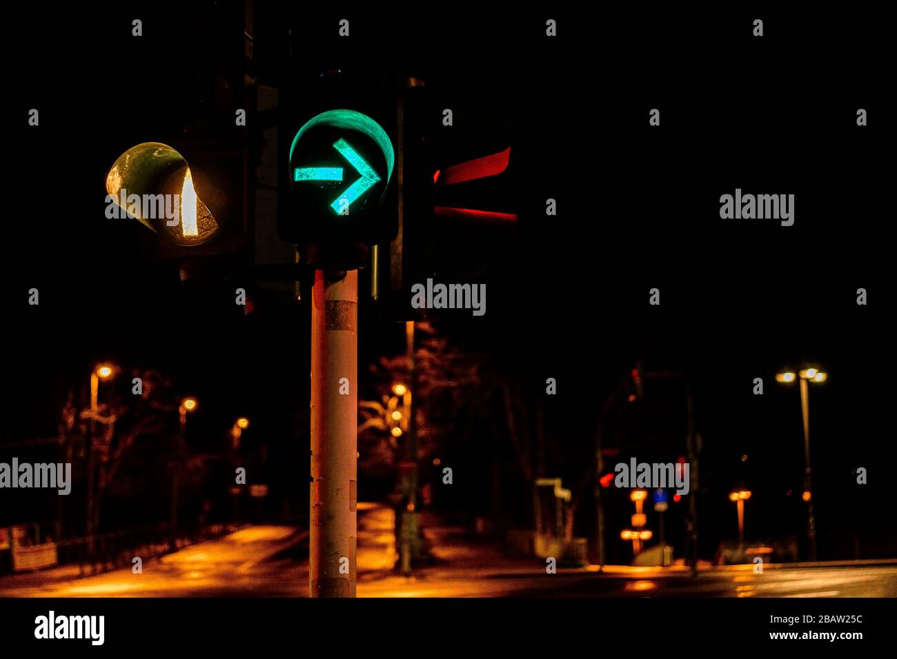 Closeup of colorful traffic lights with arrows in night city Stock ...