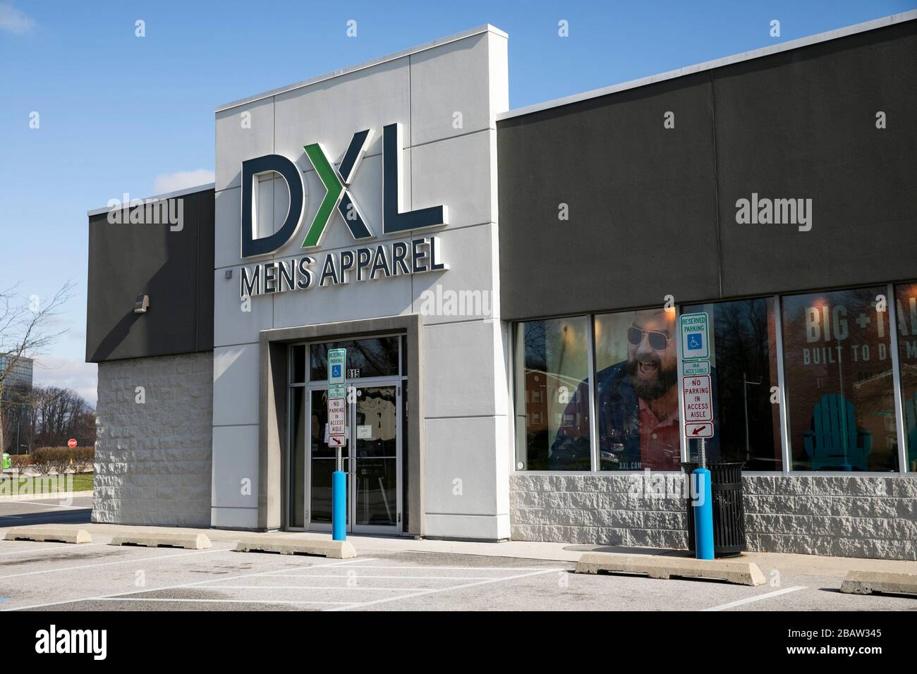 A logo sign outside of a Destination XL (DXL) retail store location in ...