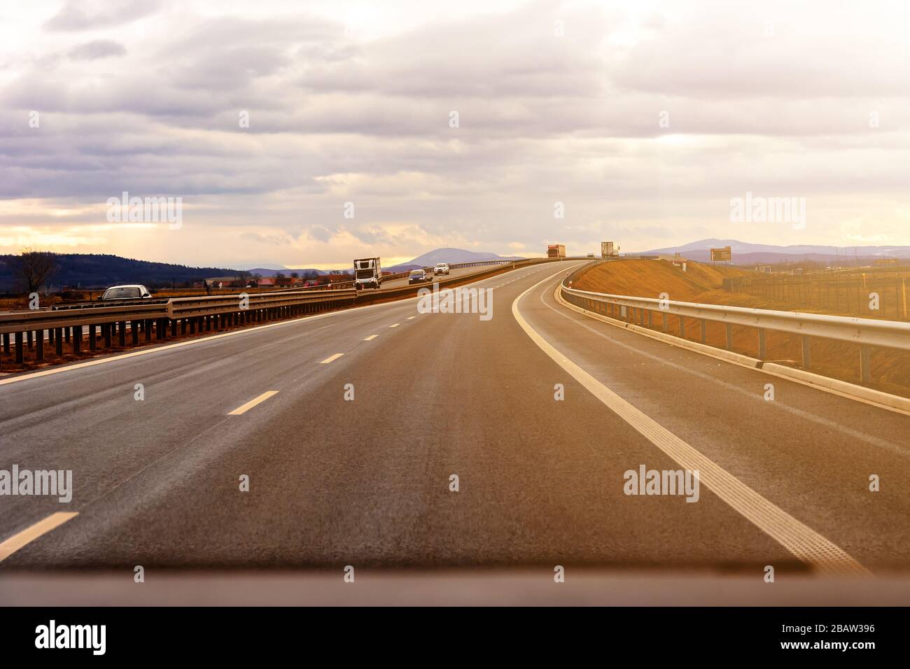 Empty track outside city with fields and road marking Stock Photo - Alamy