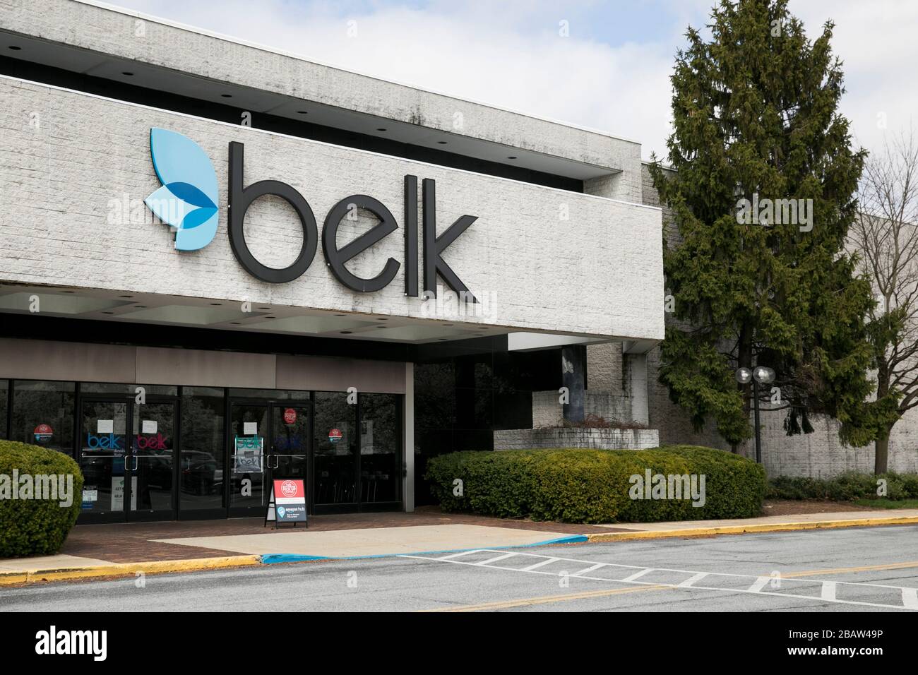 A logo sign outside of a Belk retail store location in Westminster ...
