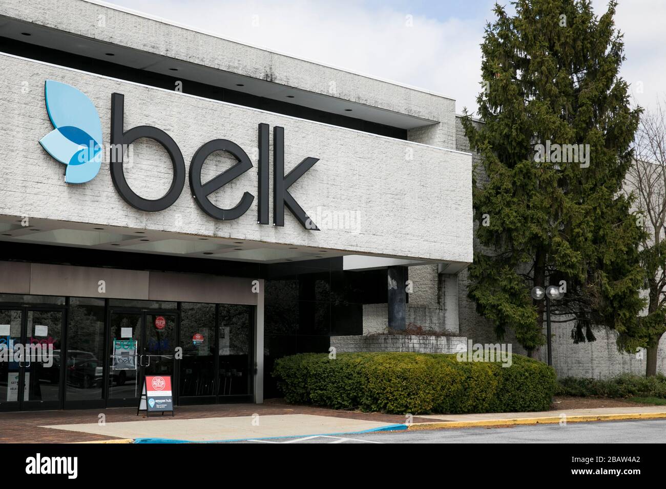 A logo sign outside of a Belk retail store location in Westminster ...