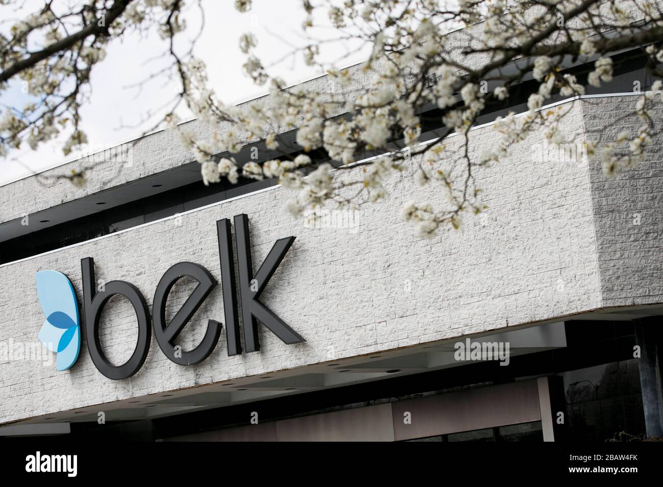 A logo sign outside of a Belk retail store location in Westminster ...