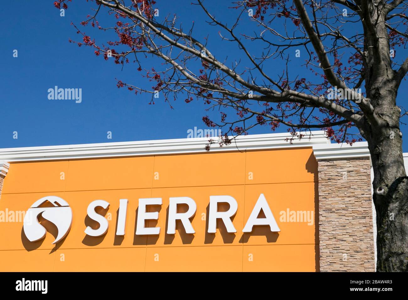 A logo sign outside of a Sierra retail store location in Frederick ...