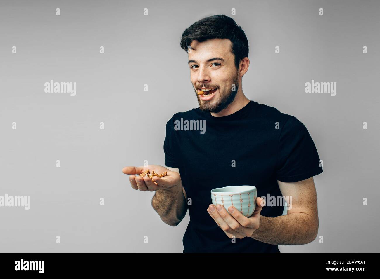 Guy eating nuts hi-res stock photography and images - Alamy