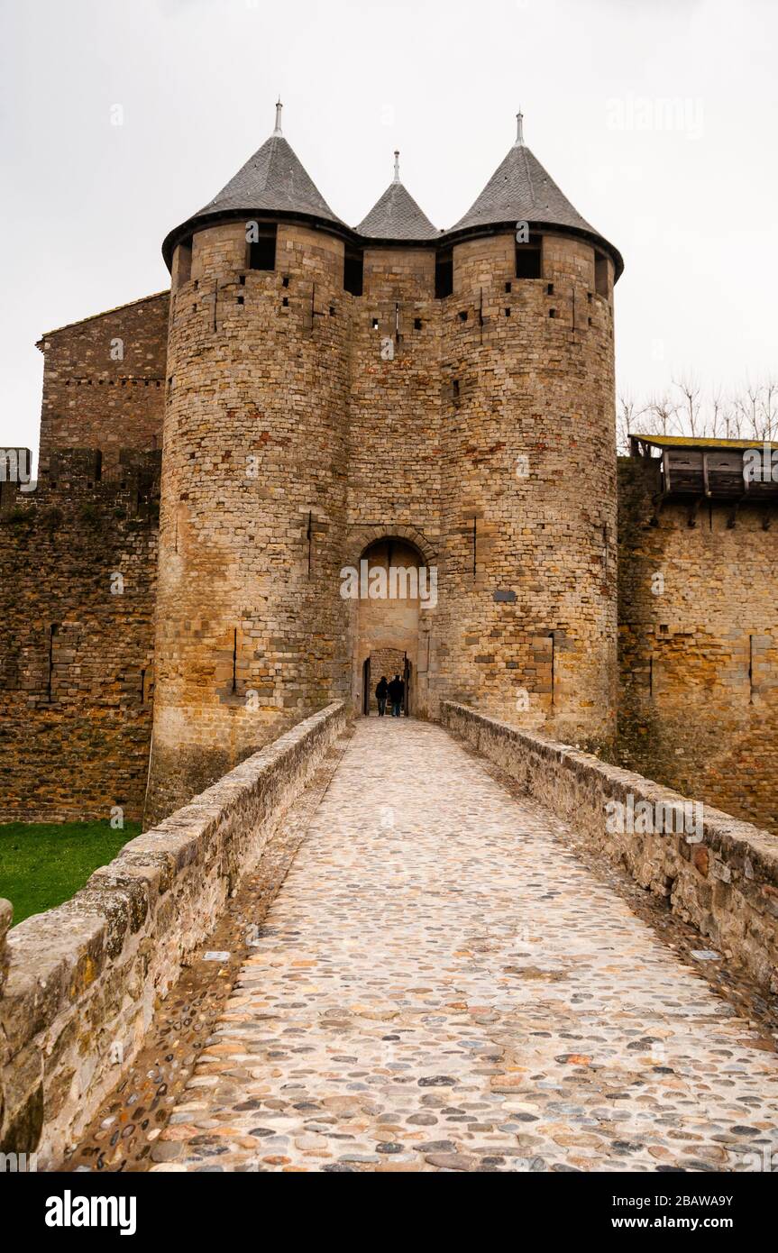 The Count's Castle entrance through defensive towers of Carcassonne ...