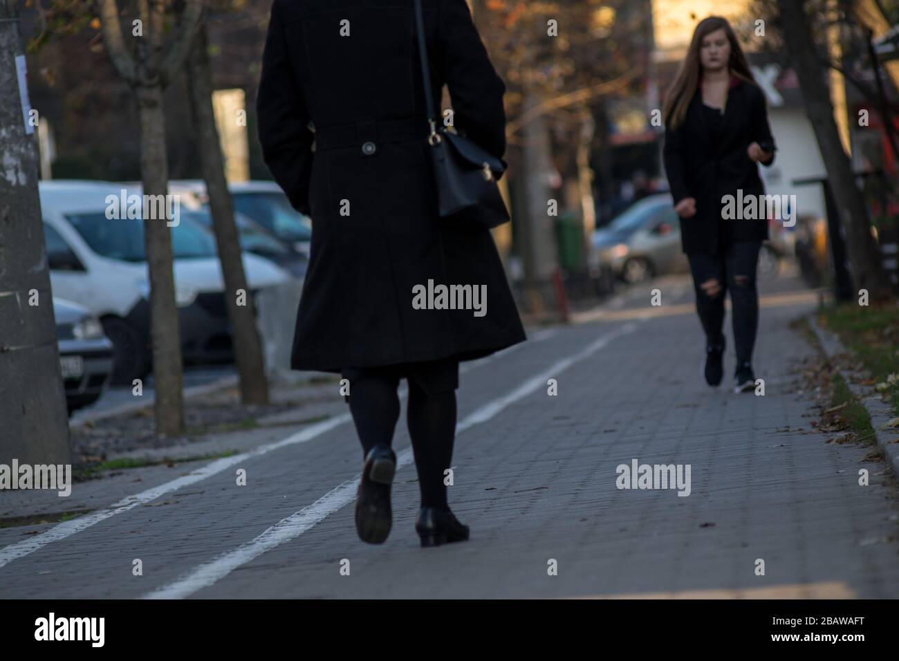 Woman walking on the street. Real people Stock Photo - Alamy