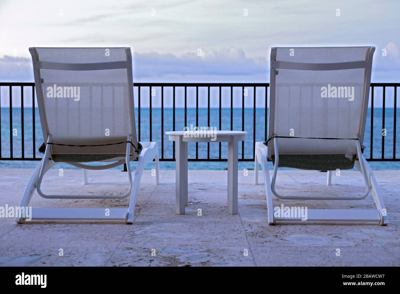 two chairs overlooking the ocean Stock Photo - Alamy