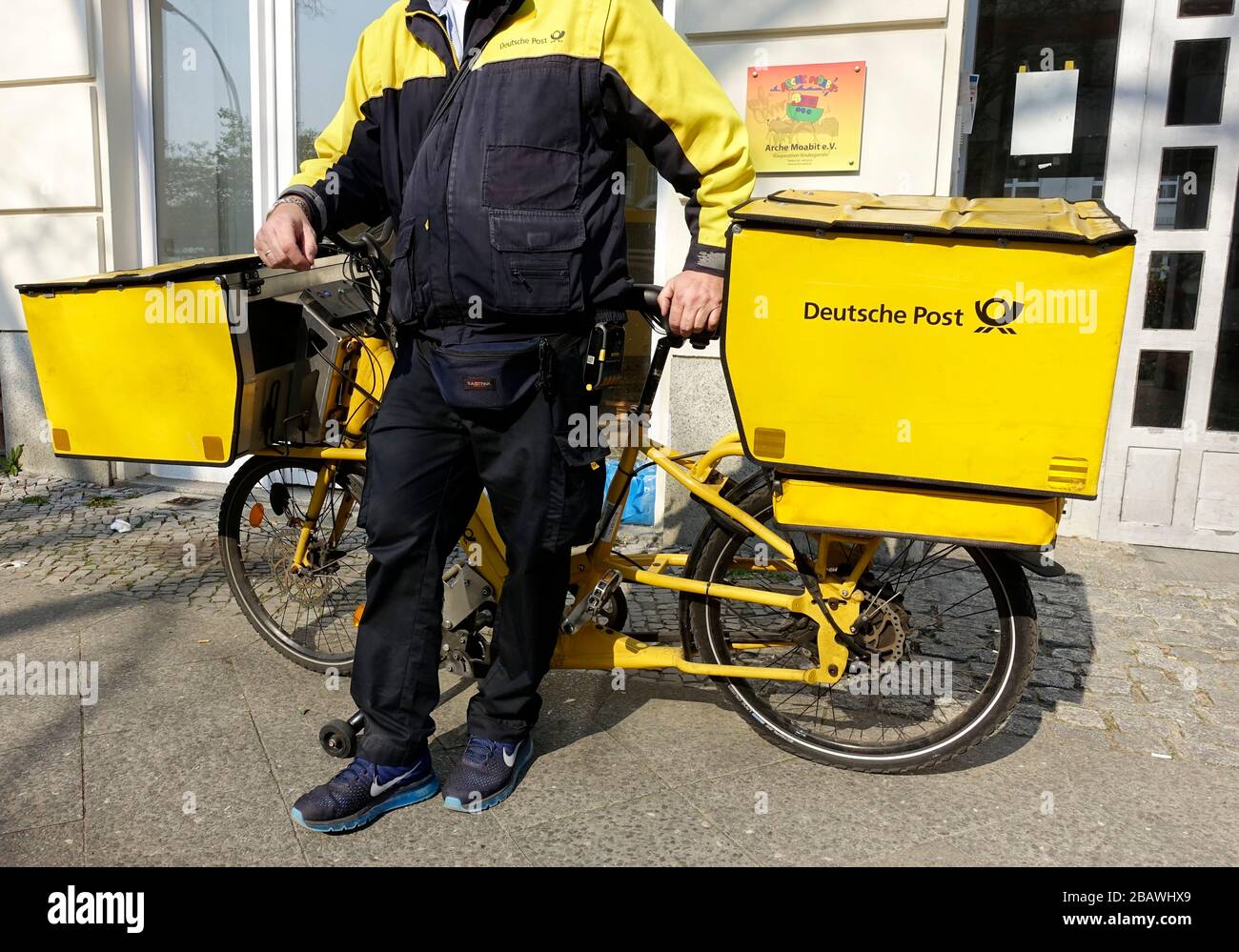 Postman of the Deutsche Post Stock Photo - Alamy