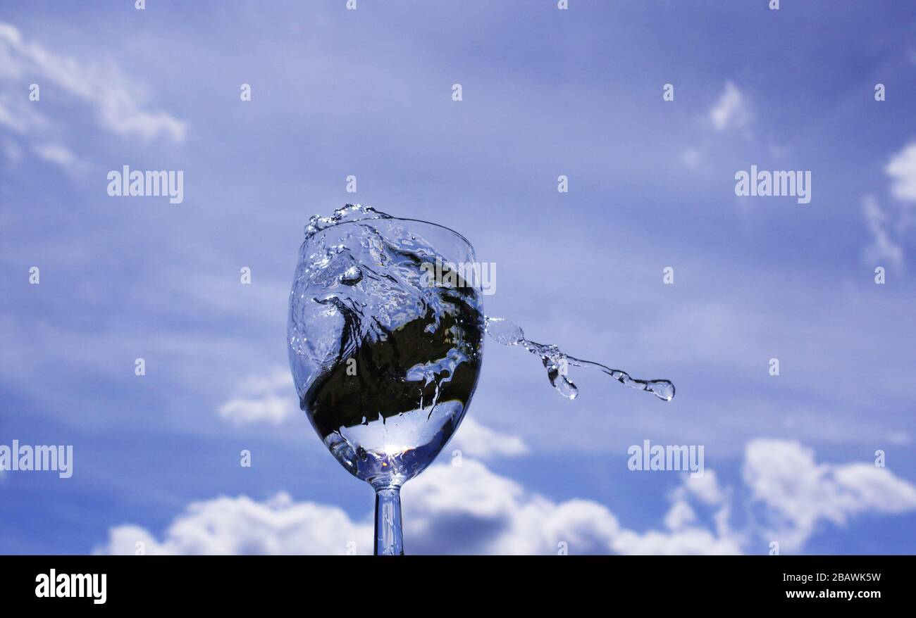 Water splashing from wine glass Stock Photo - Alamy