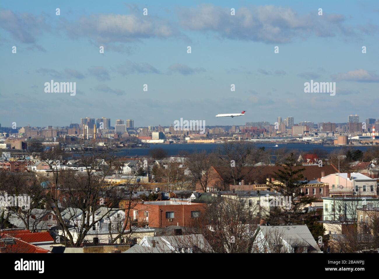 airplane into New York City Stock Photo - Alamy