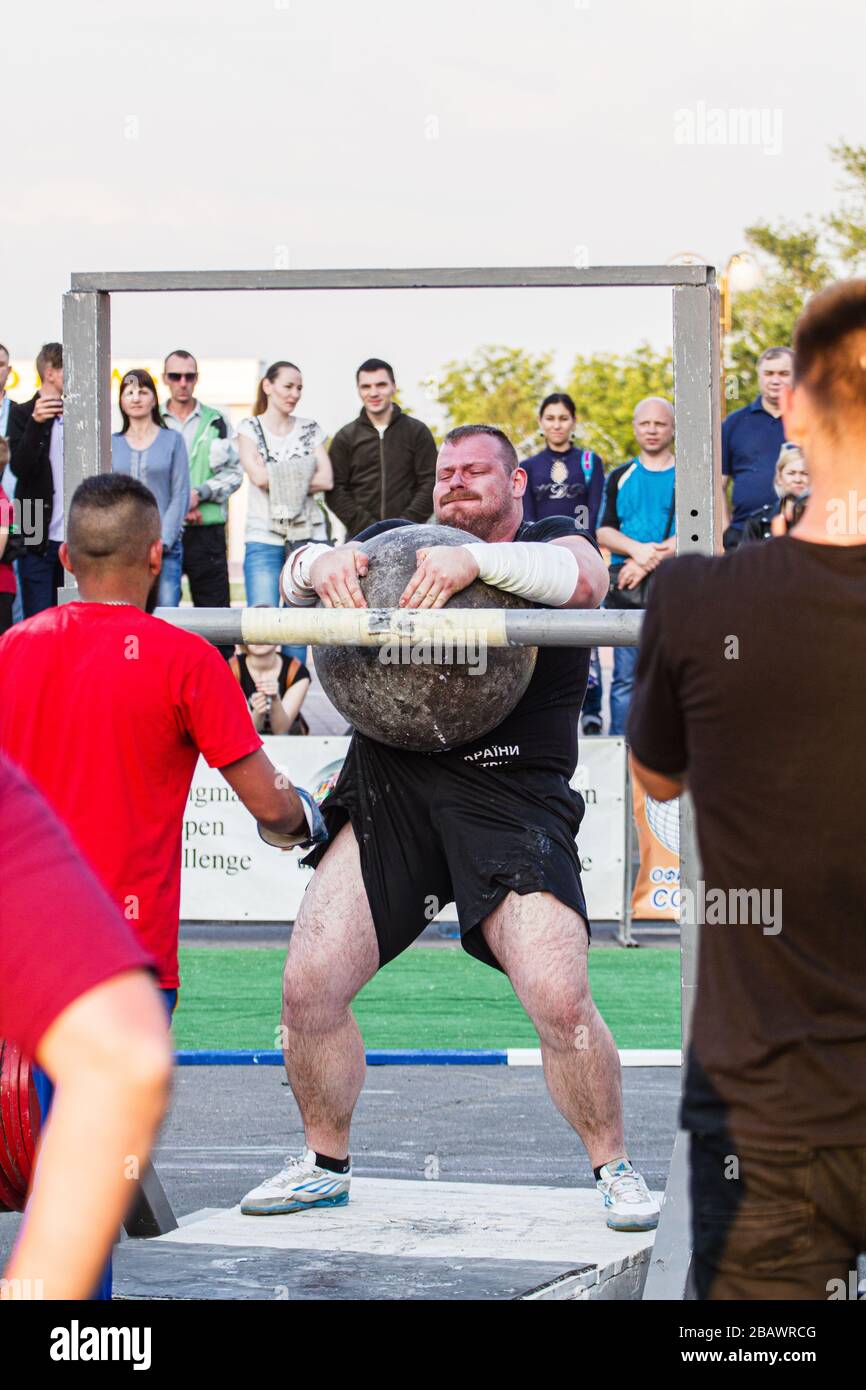 Strong Man Car Lift High Resolution Stock Photography and Images - Alamy