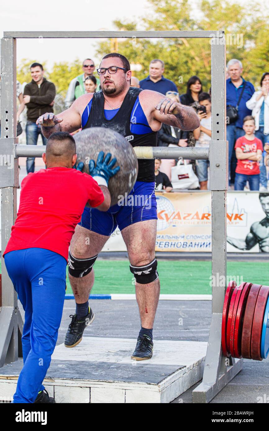 Strong Man Car Lift High Resolution Stock Photography and Images - Alamy