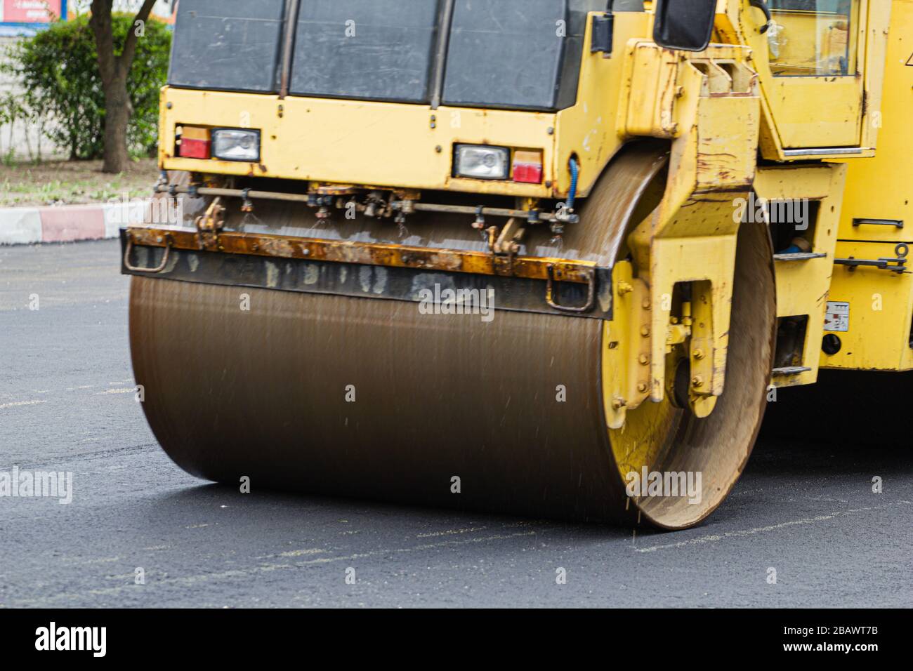 The rink compacts the road surface, road repair in the street in the ...