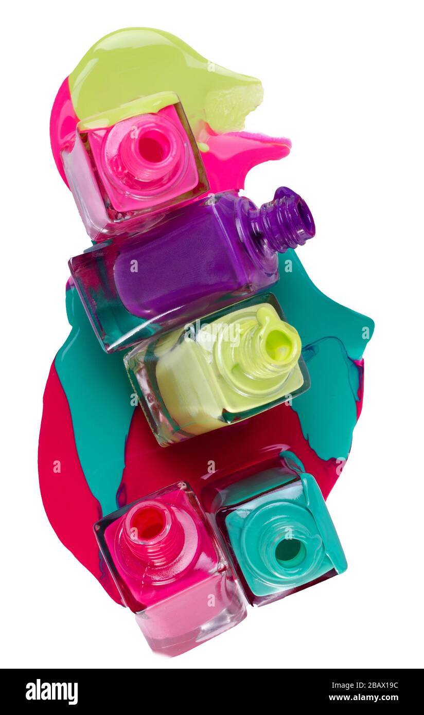 Nail polish tubes and bright colors of splash isolated on white ...