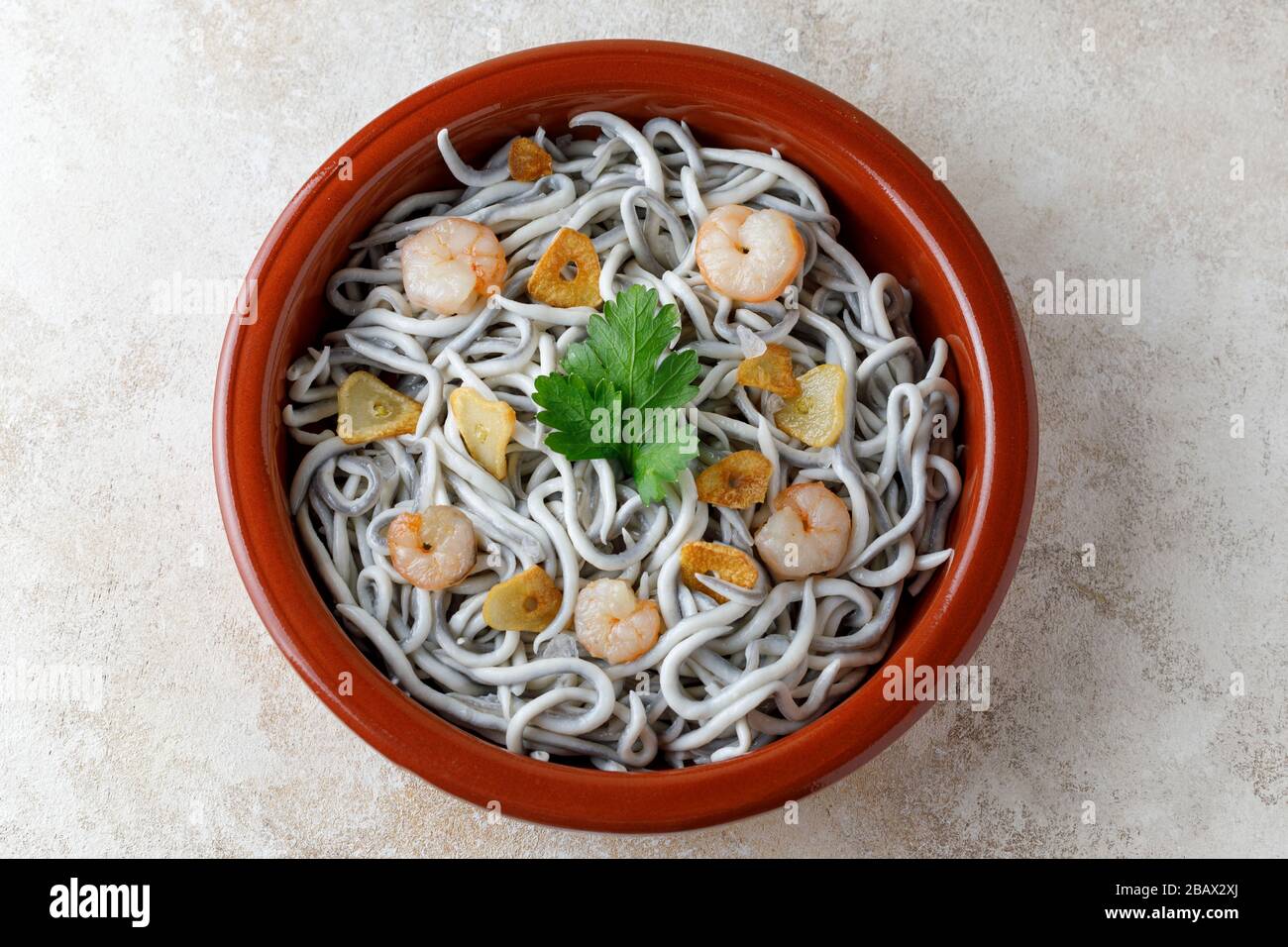 Angula with prawn and parsley Stock Photo - Alamy