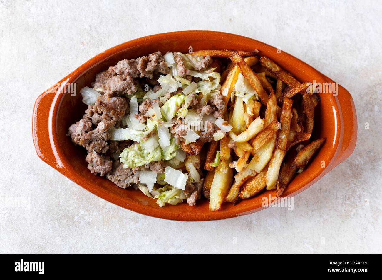 Traditional cuban potatoes with minced meat, lettuce and onion Stock ...