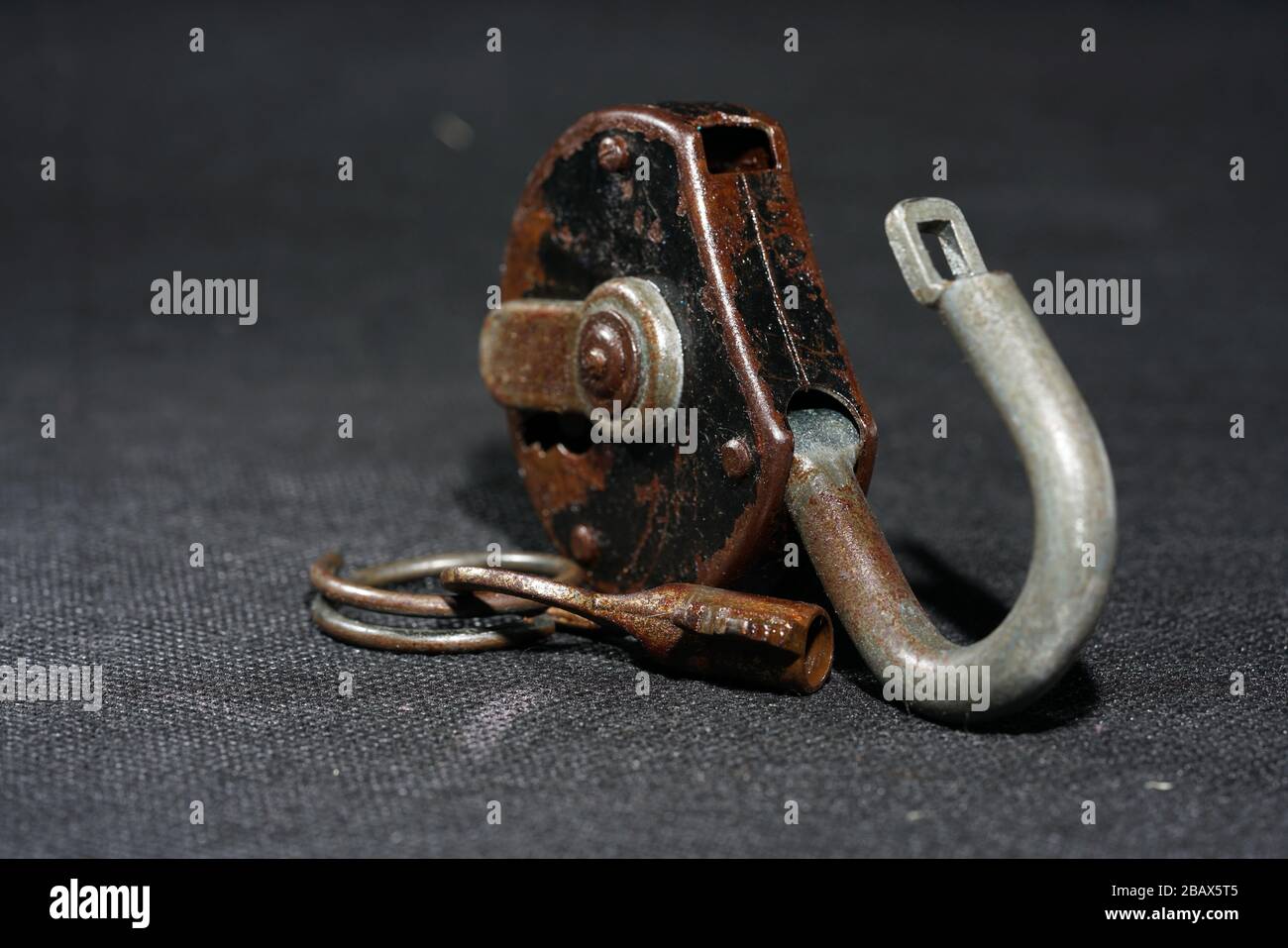 Old padlock with rust but fully functional photographed in the studio ...