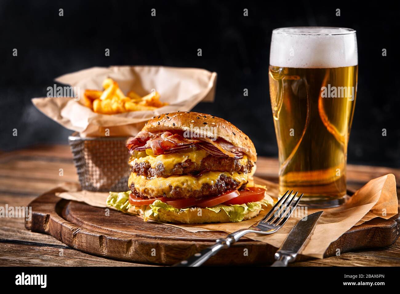 Set of hamburger beer and french fries. A standard set of drinks and ...
