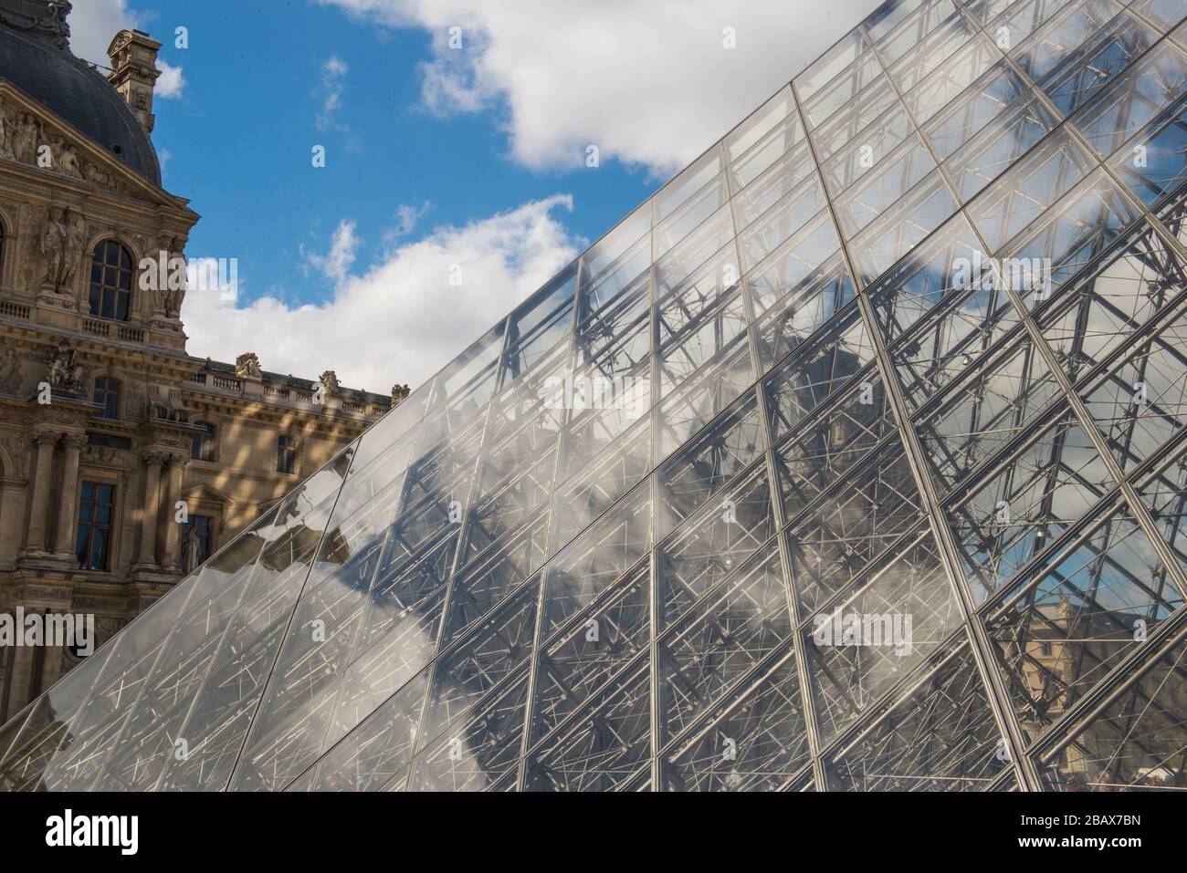 Louvre Palace and triangle glass in Paris Stock Photo - Alamy