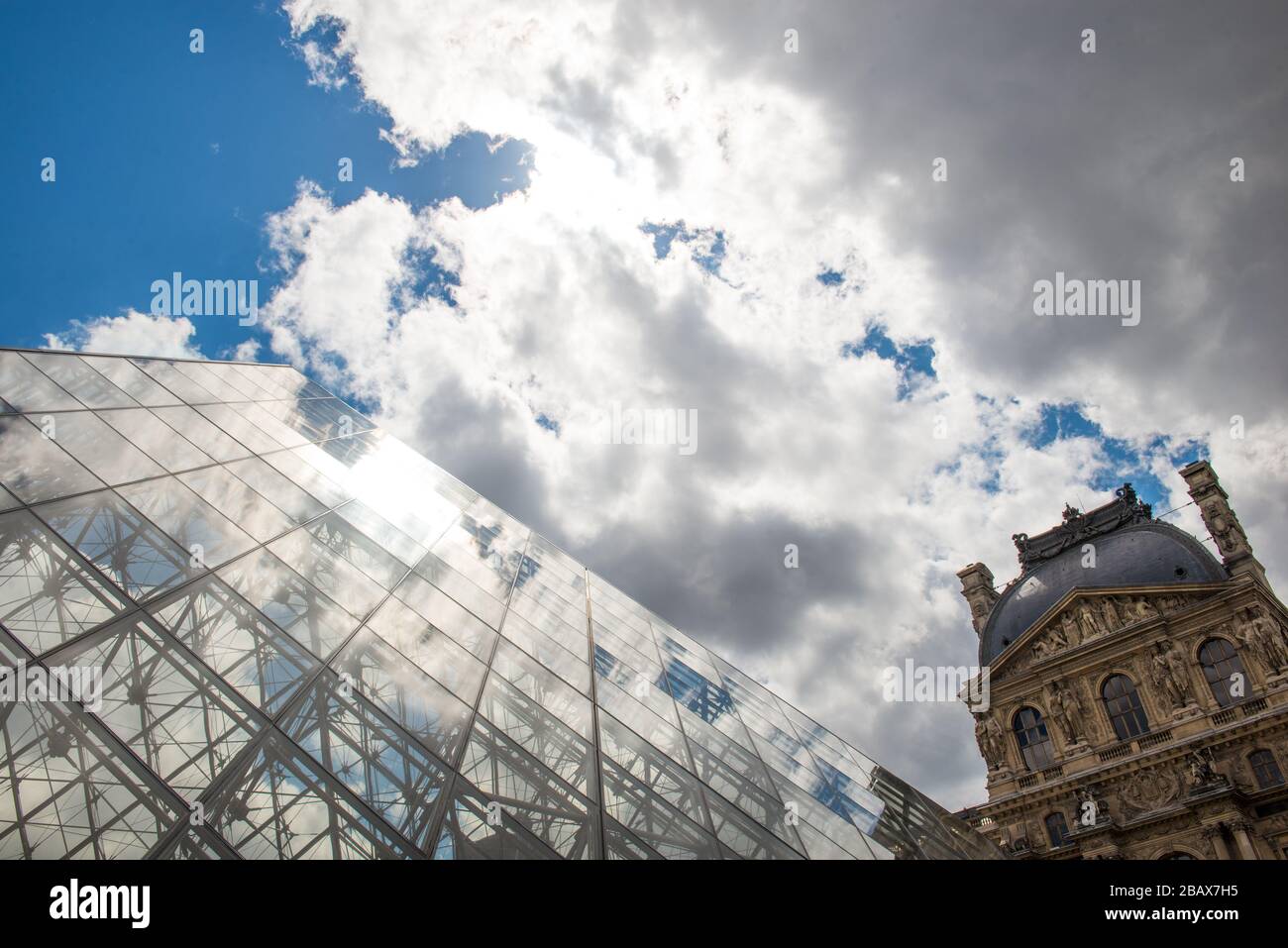 Louvre Palace and triangle glass in Paris Stock Photo - Alamy