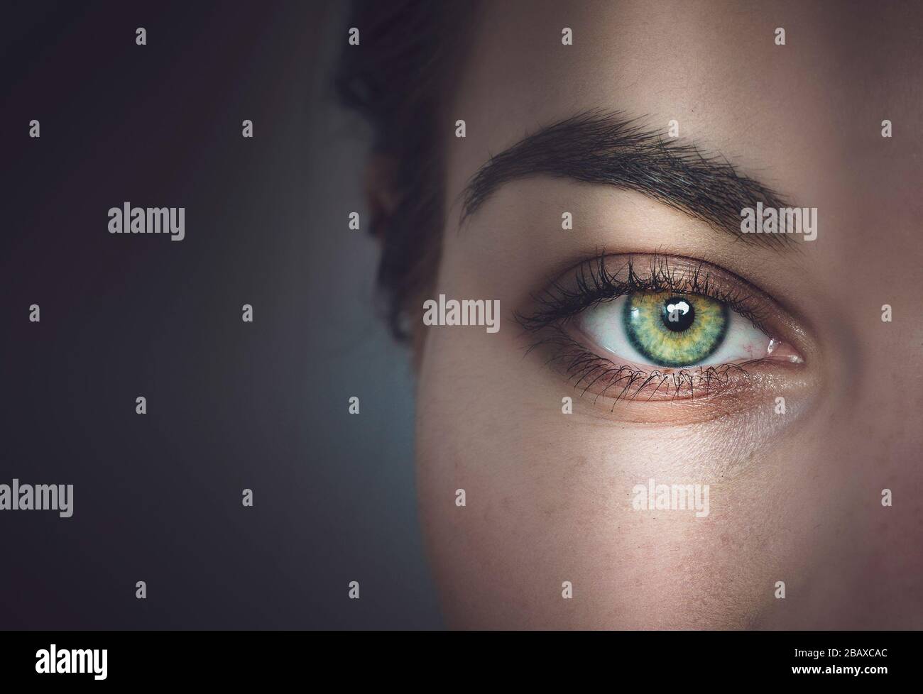 eyes spying concept through hole against dark background Stock Photo ...