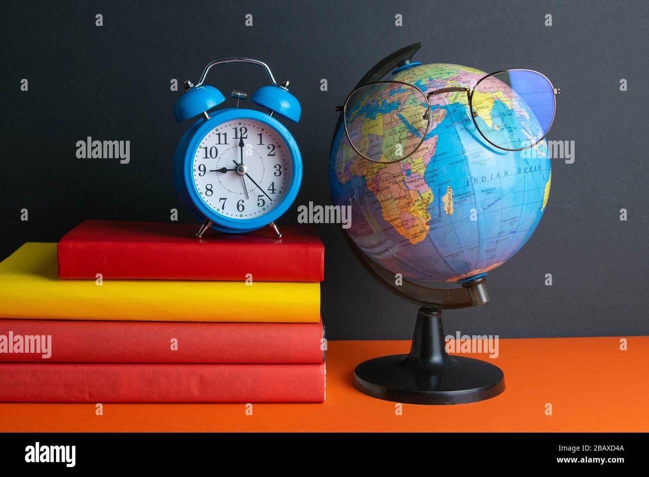 Globe Clock On Books High Resolution Stock Photography and Images - Alamy