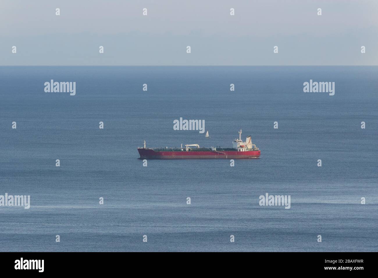 empty oil tanker alone in the middle of blue calm ocean Stock Photo - Alamy