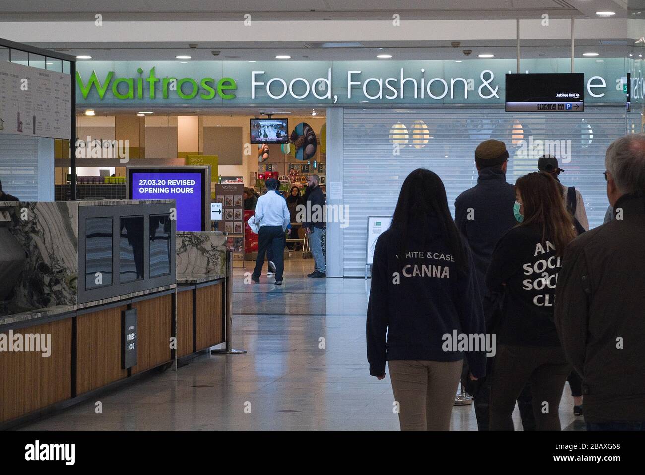 People queuing to enter supermarket store in Canary Wharf due to ...