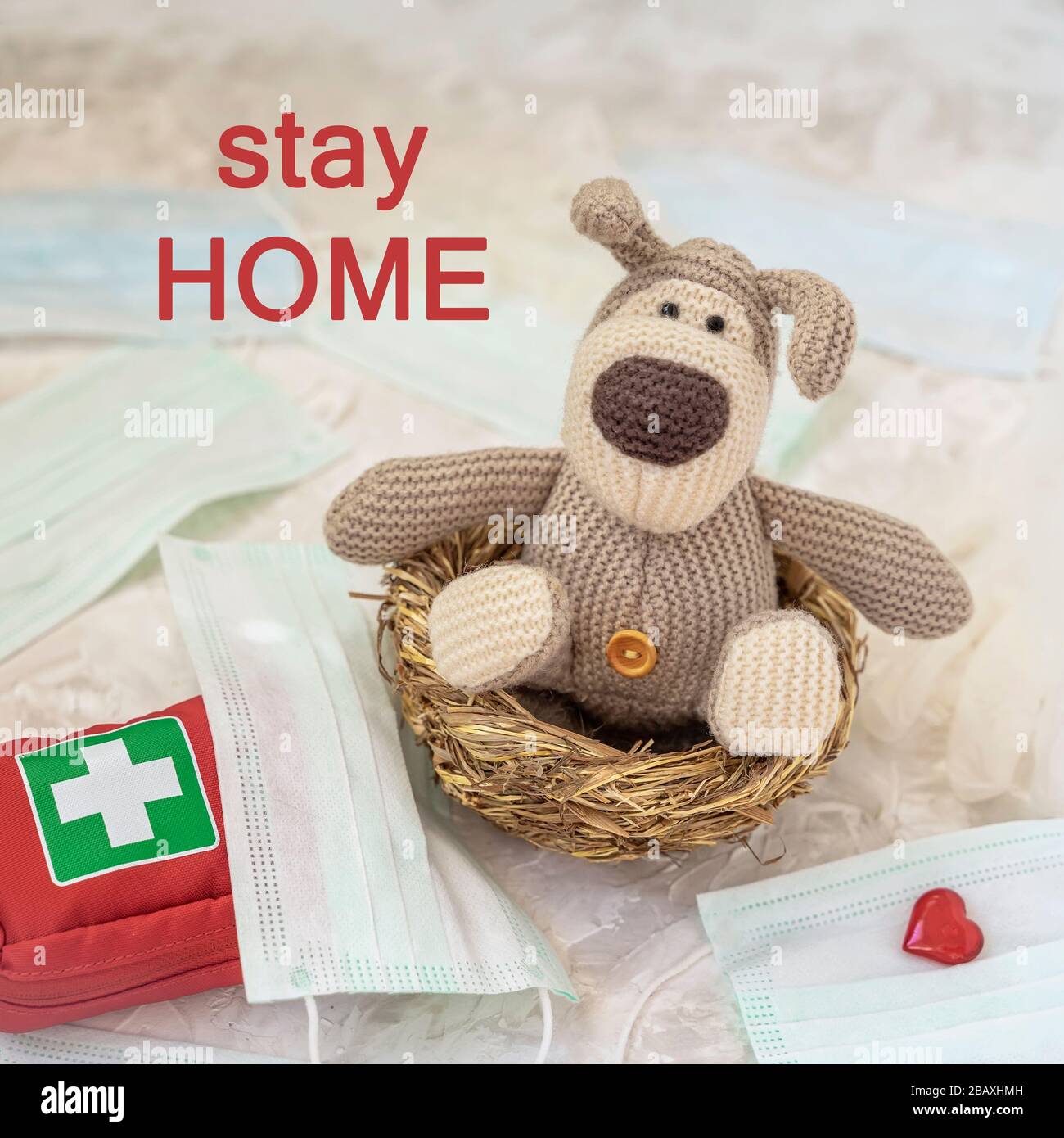 Stay at home, text of motivational words, on background of toy puppy ...