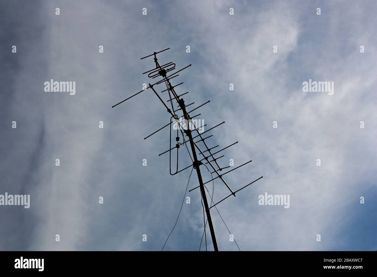Image of an old style analog television antenna with the sky in the ...