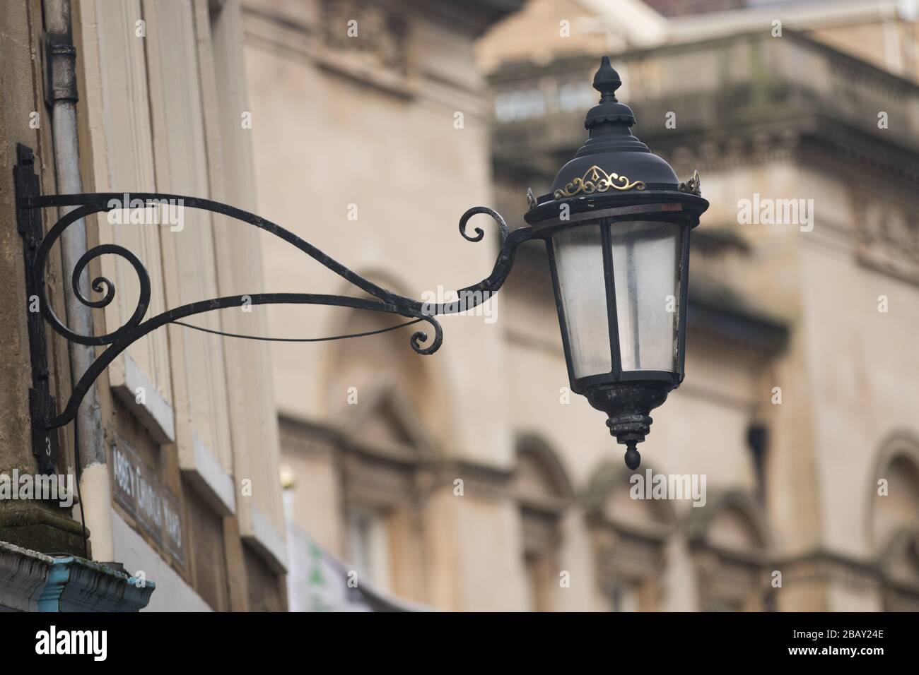 A street light on a building in the historical City of Bath, Somerset ...