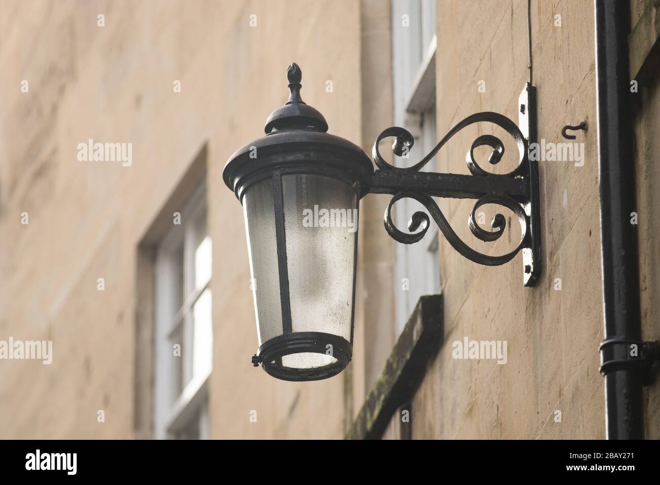 A street light on a building in the historical City of Bath, Somerset ...